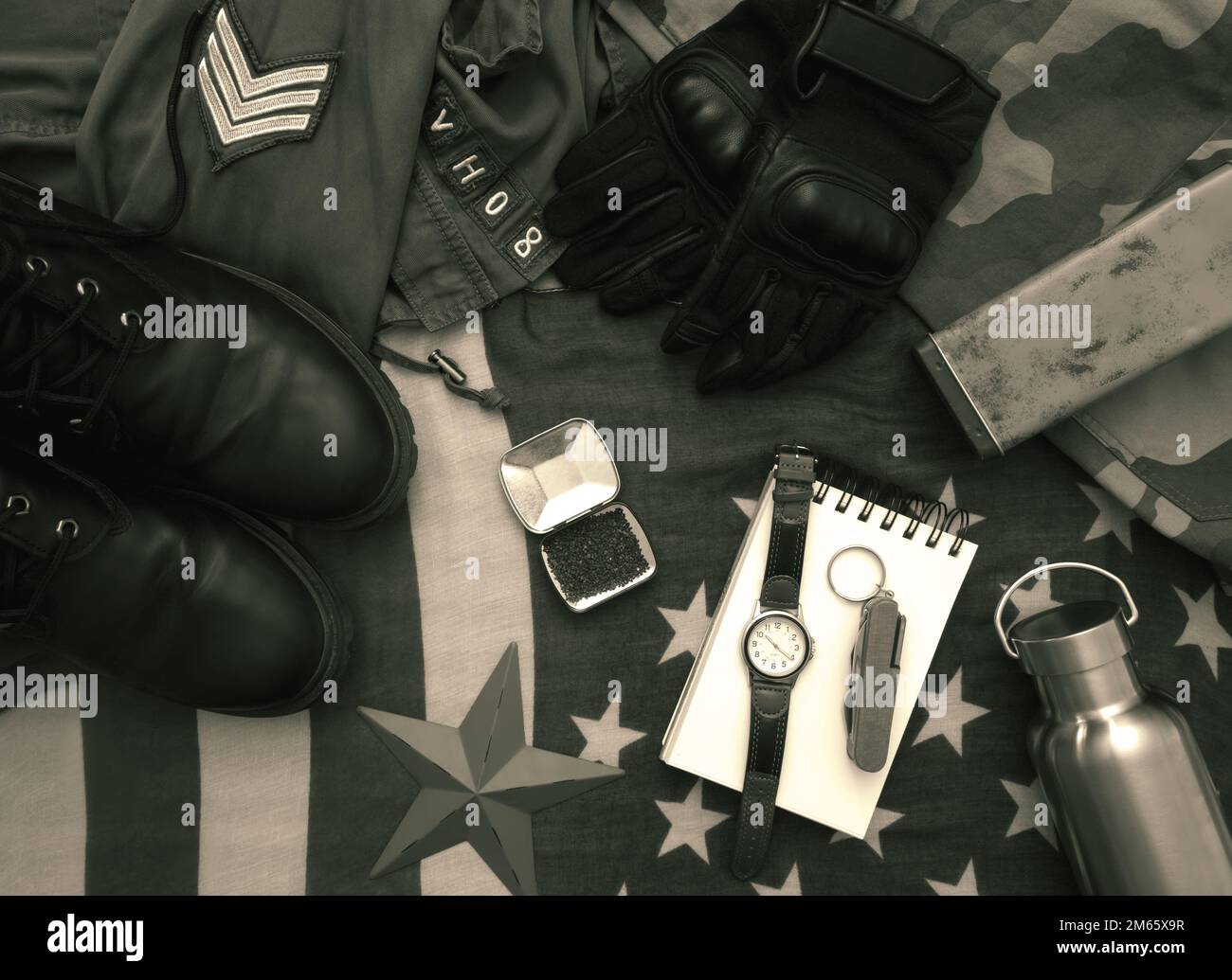 Black and white overhead flat lay of military items laid out on an ...