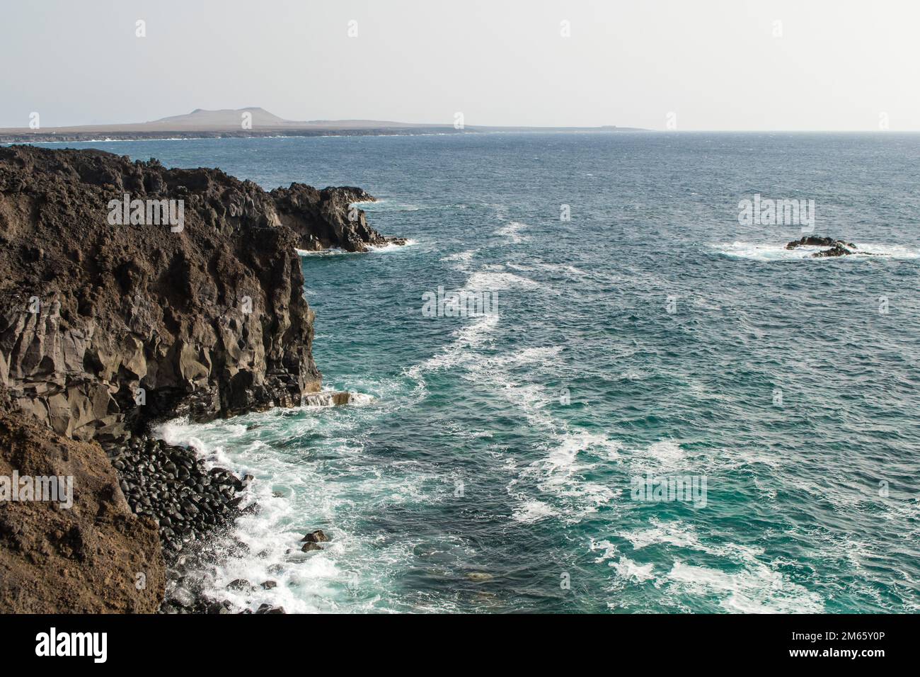 The contrast here between the emerald colored lagoon and the black ...