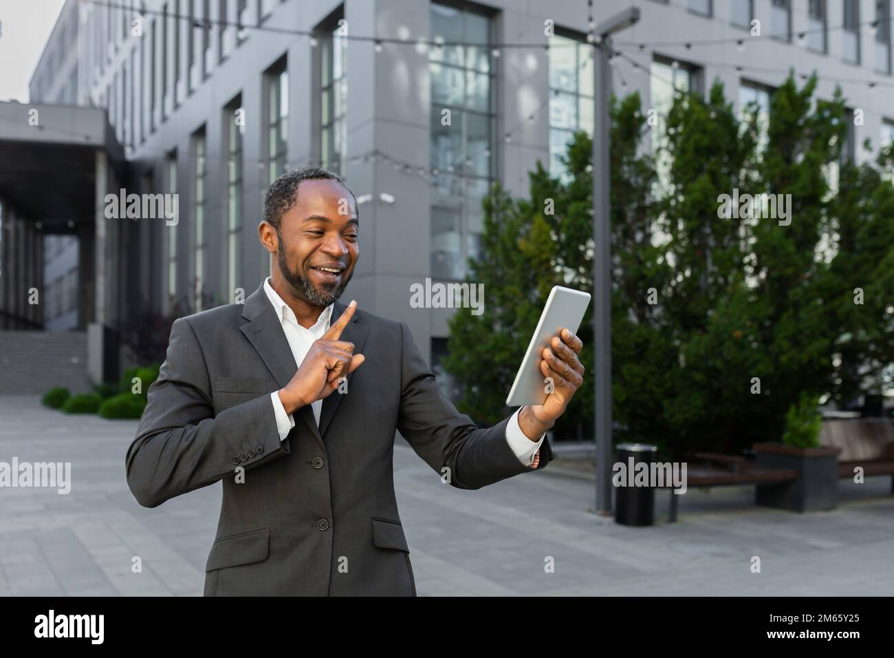 Mature african american boss businessman outside office building with ...