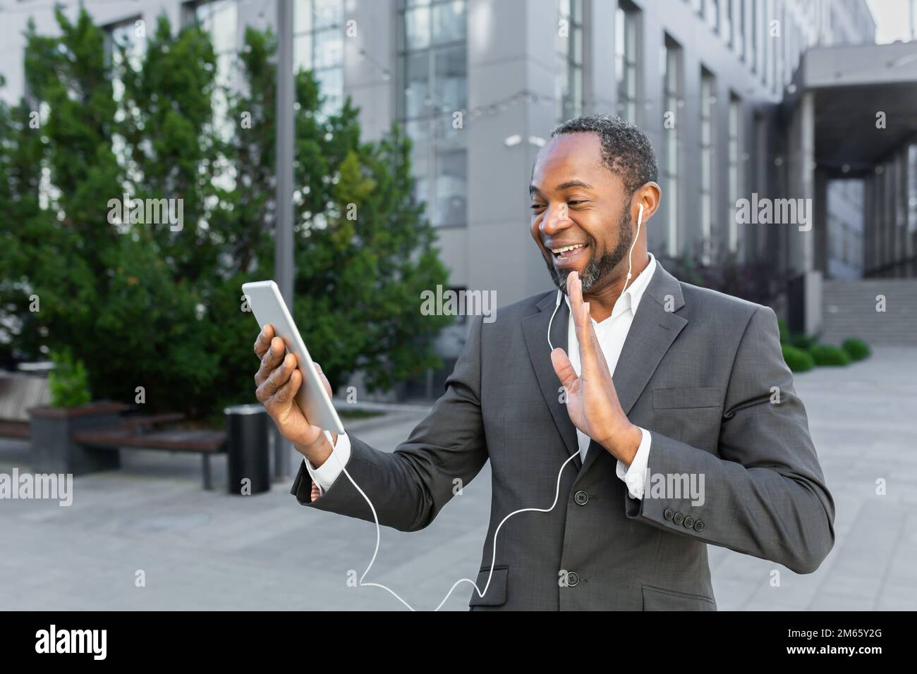 Mature african american boss businessman outside office building with ...