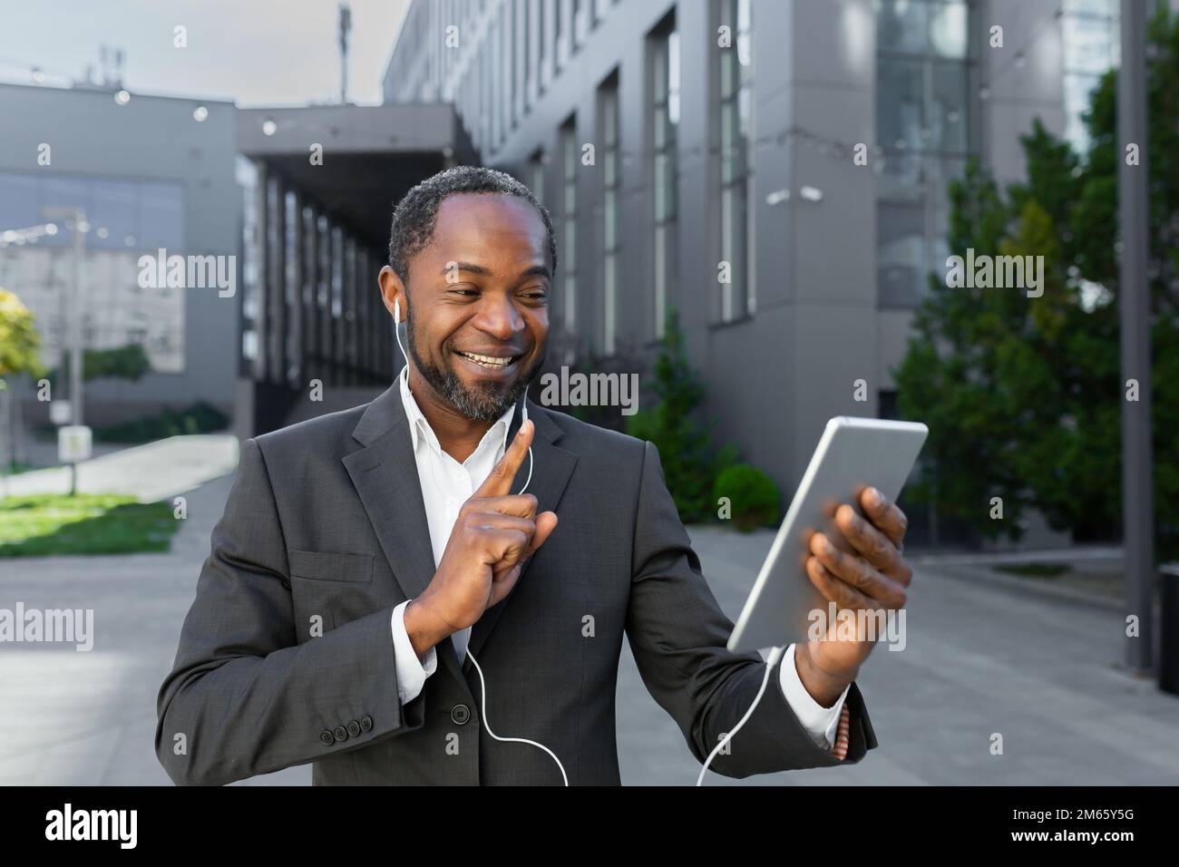 Mature african american boss businessman outside office building with ...