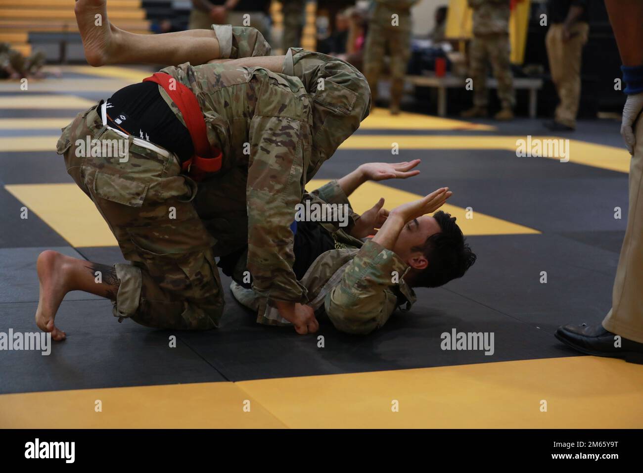 U.S. Army Sgt. Bryan Taesali (bottom), an infantryman and sniper with ...