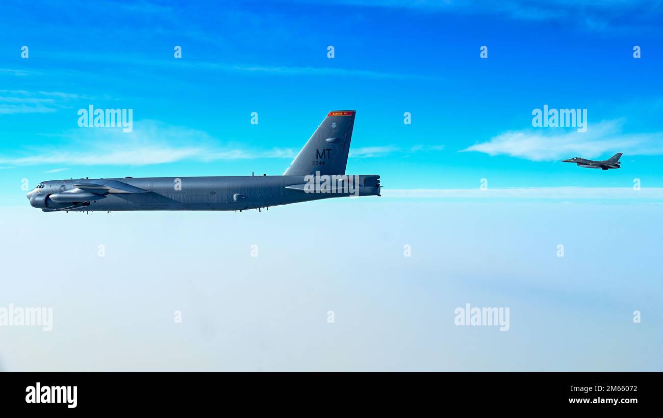 A Hellenic Air Force F-16 flies with a United States Air Force B-52H ...