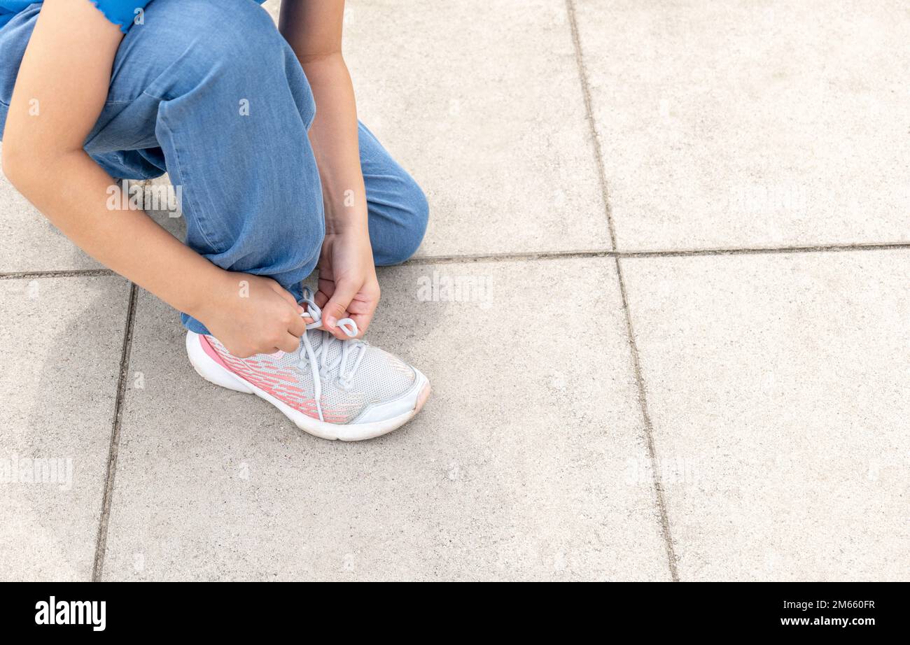 Tying shoes and kid hi-res stock photography and images - Alamy