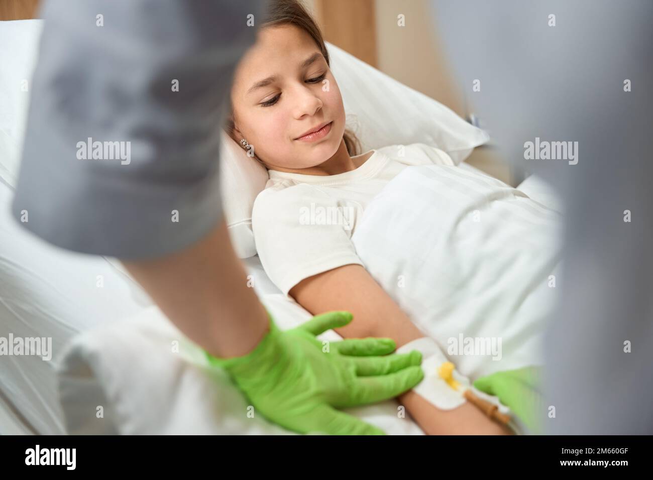 Nurse performs a medical manipulation on a small patient Stock Photo ...