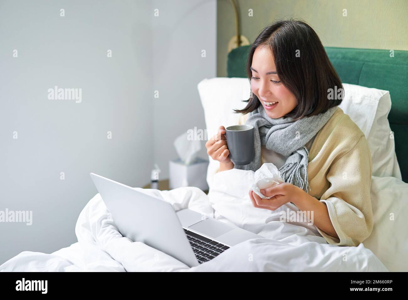 Portrait of asian sick girl, lying in bed with cold, having flu ...