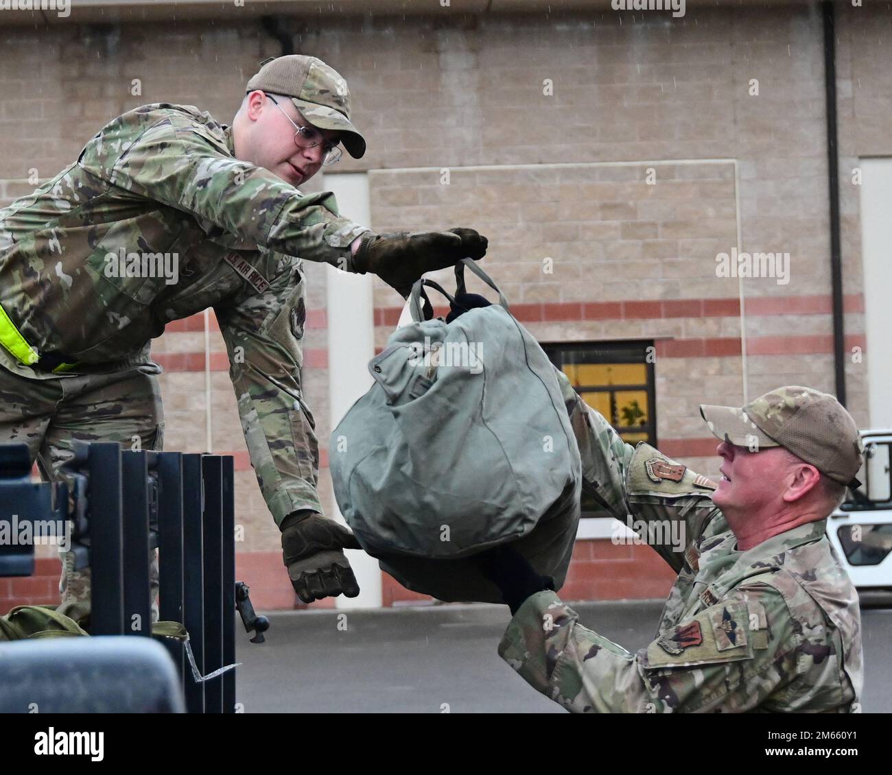 Airmen From The 118th Wing Hand Off C Bags To Each Other April 7 2022