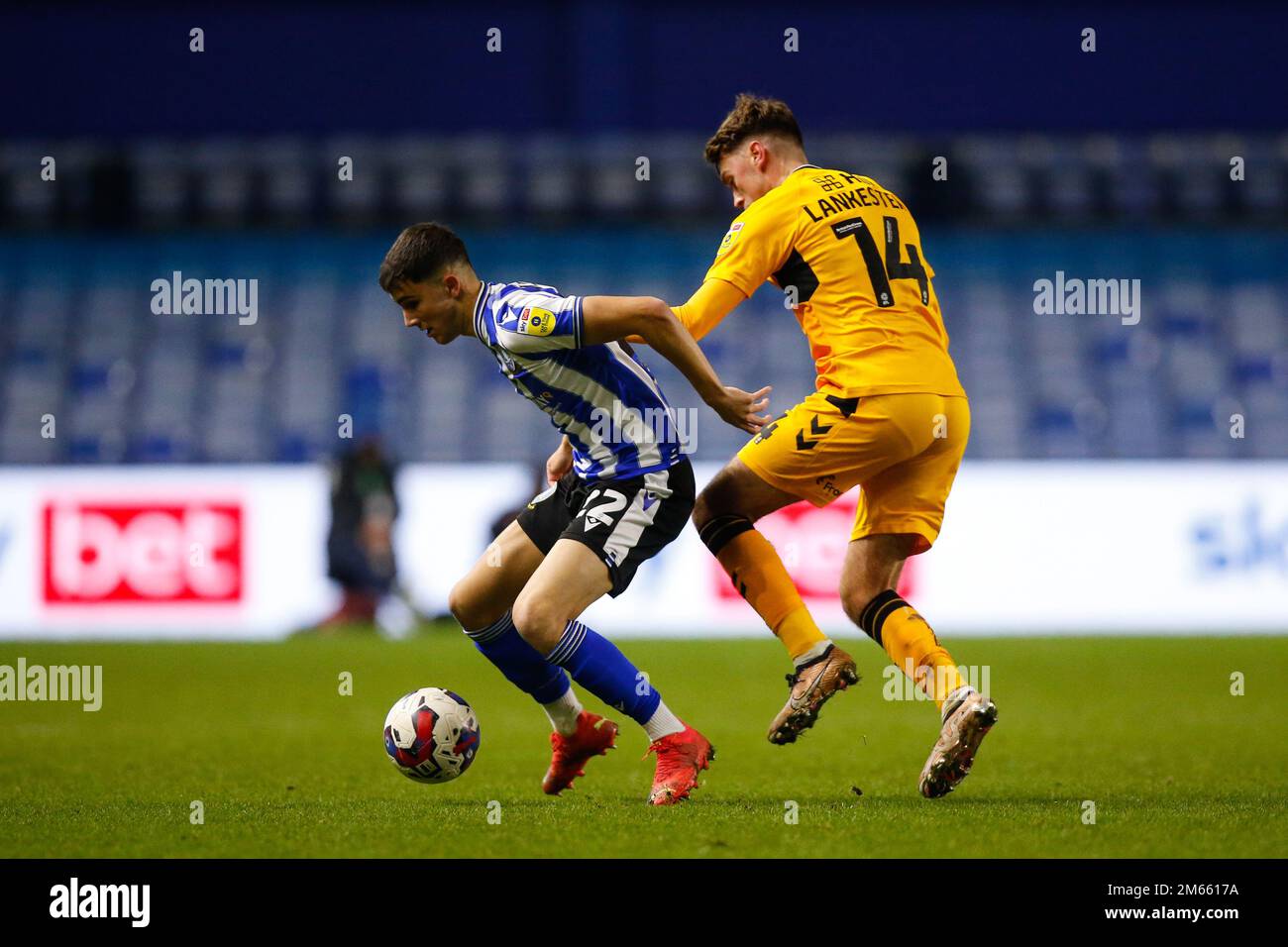 Rio Shipston #22 of Sheffield Wednesday and Jack Lankester #14 of ...