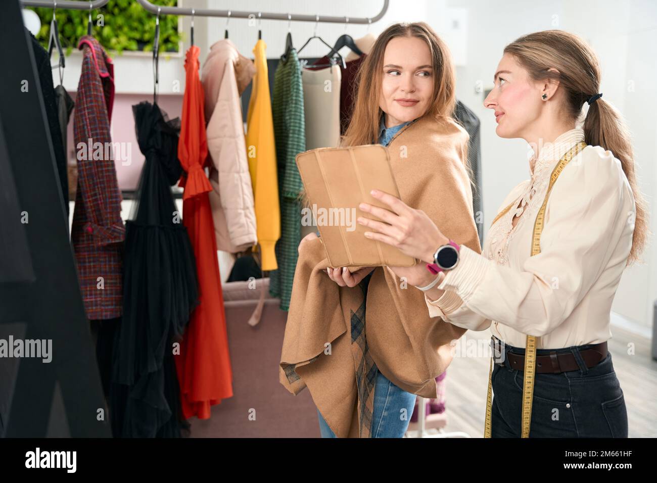 Client receives a stylist consultation in a design workshop Stock Photo ...