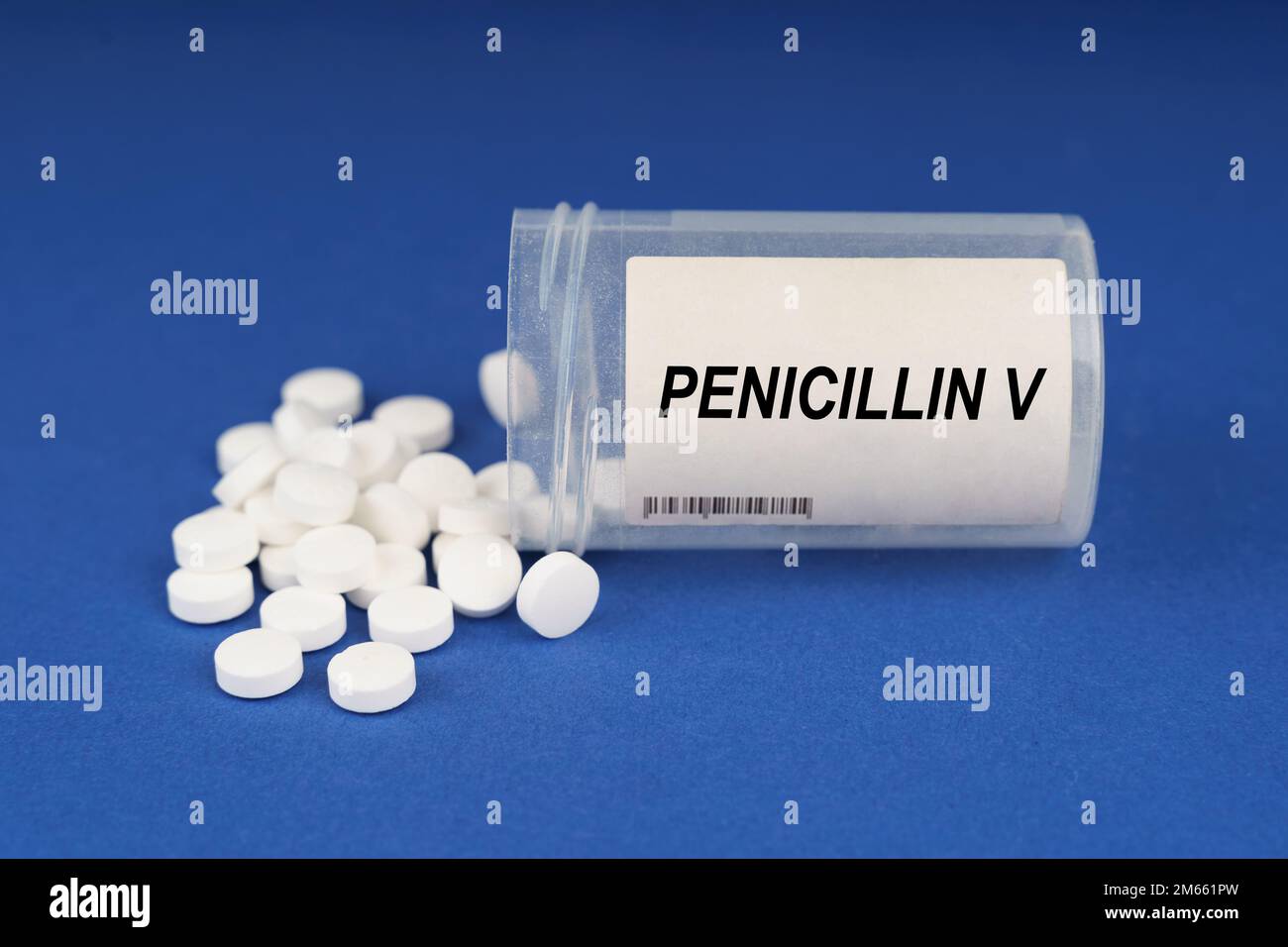 The concept of pharmacology and health. On a blue surface are pills and ...