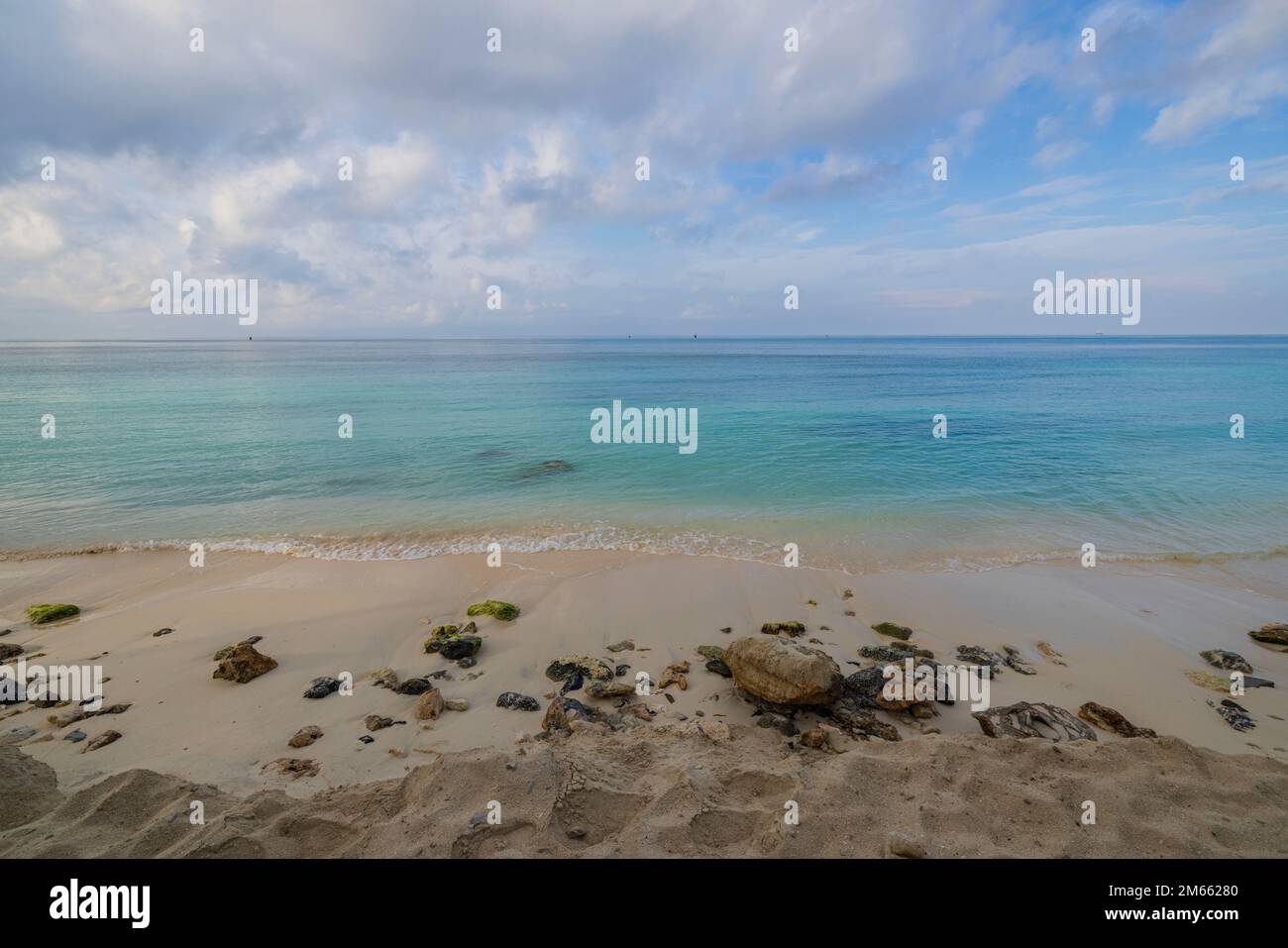 Beautiful view of sandy coastline beach and calm turquoise water ...