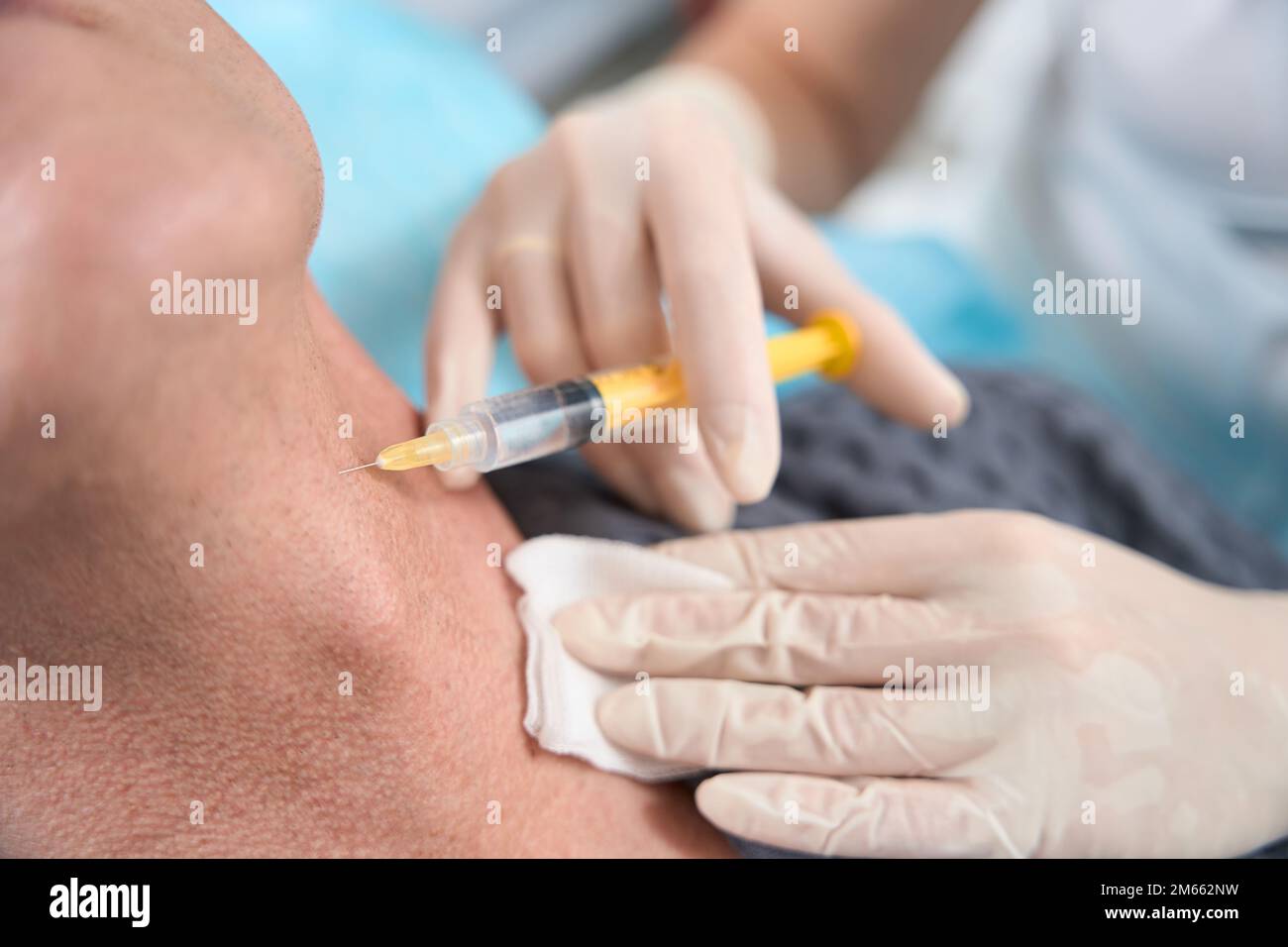 Doctor injecting platelet rich plasma into skin of human neck Stock ...