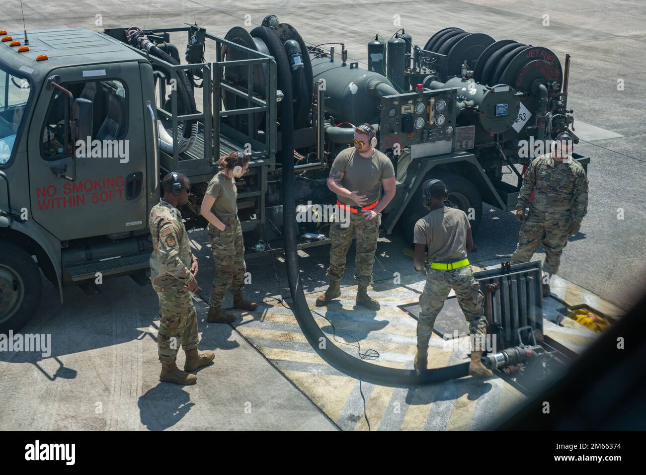 Members from the 18th Logistics Readiness Squadron and 909th Aircraft ...