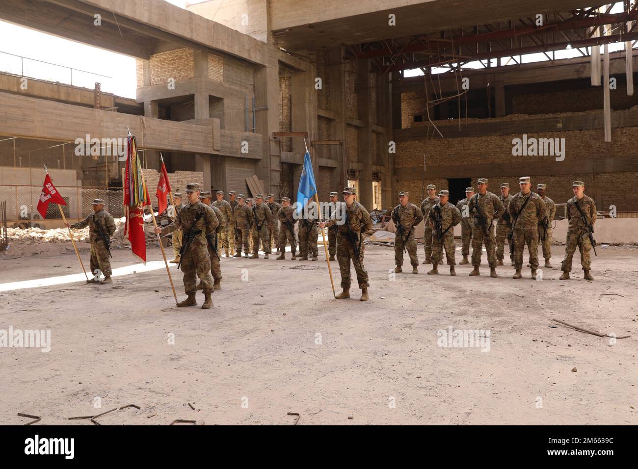 U.S. Soldiers assigned to Task Force Pioneer stand at the position of ...