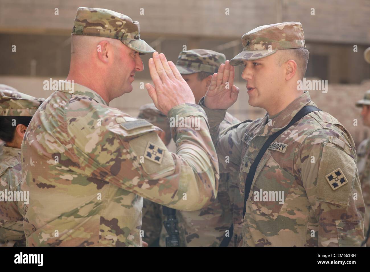 Lt. Col. Gregory Polk, commander, Task Force Pioneer, renders a salute ...