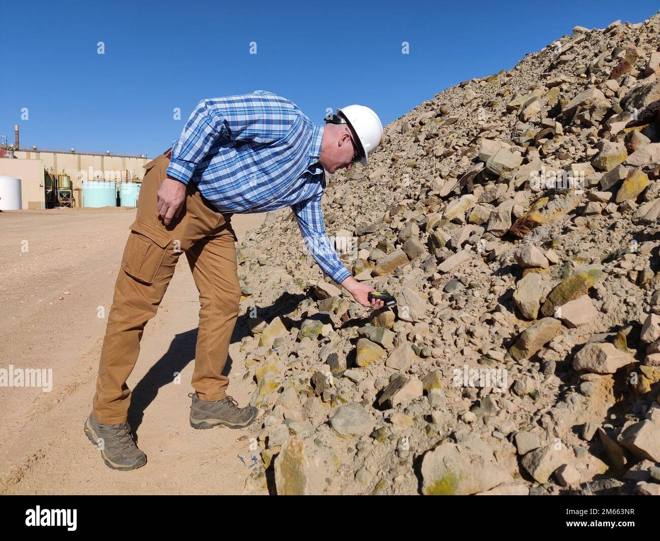 Col. John P. Kunstbeck scans uranium ore for alpha and beta radiation ...
