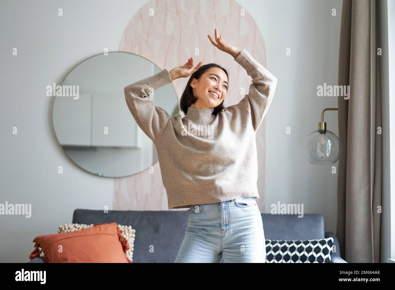 Women and wellbeing. Beautiful young asian woman dancing, feeling ...