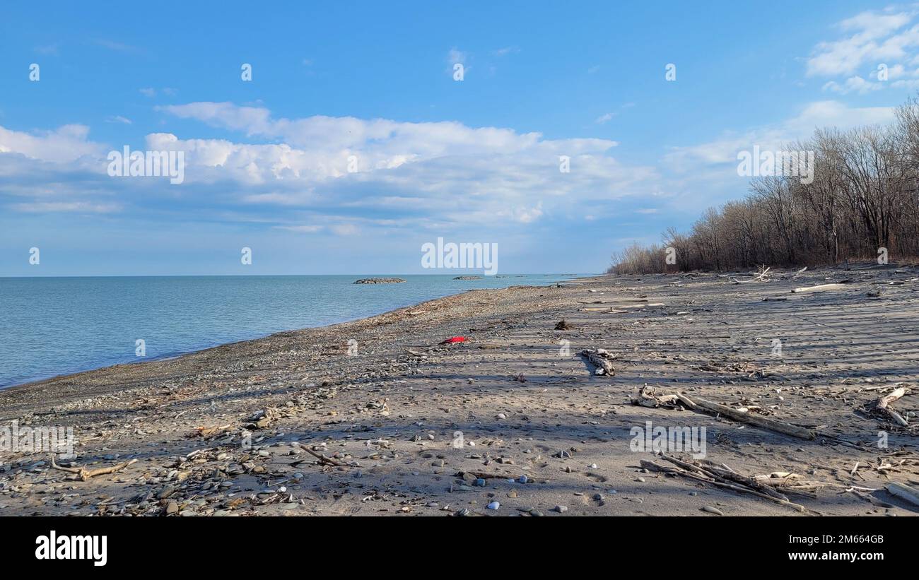Sand lines the beach at Presque Isle State Park, part of a peninsula on ...