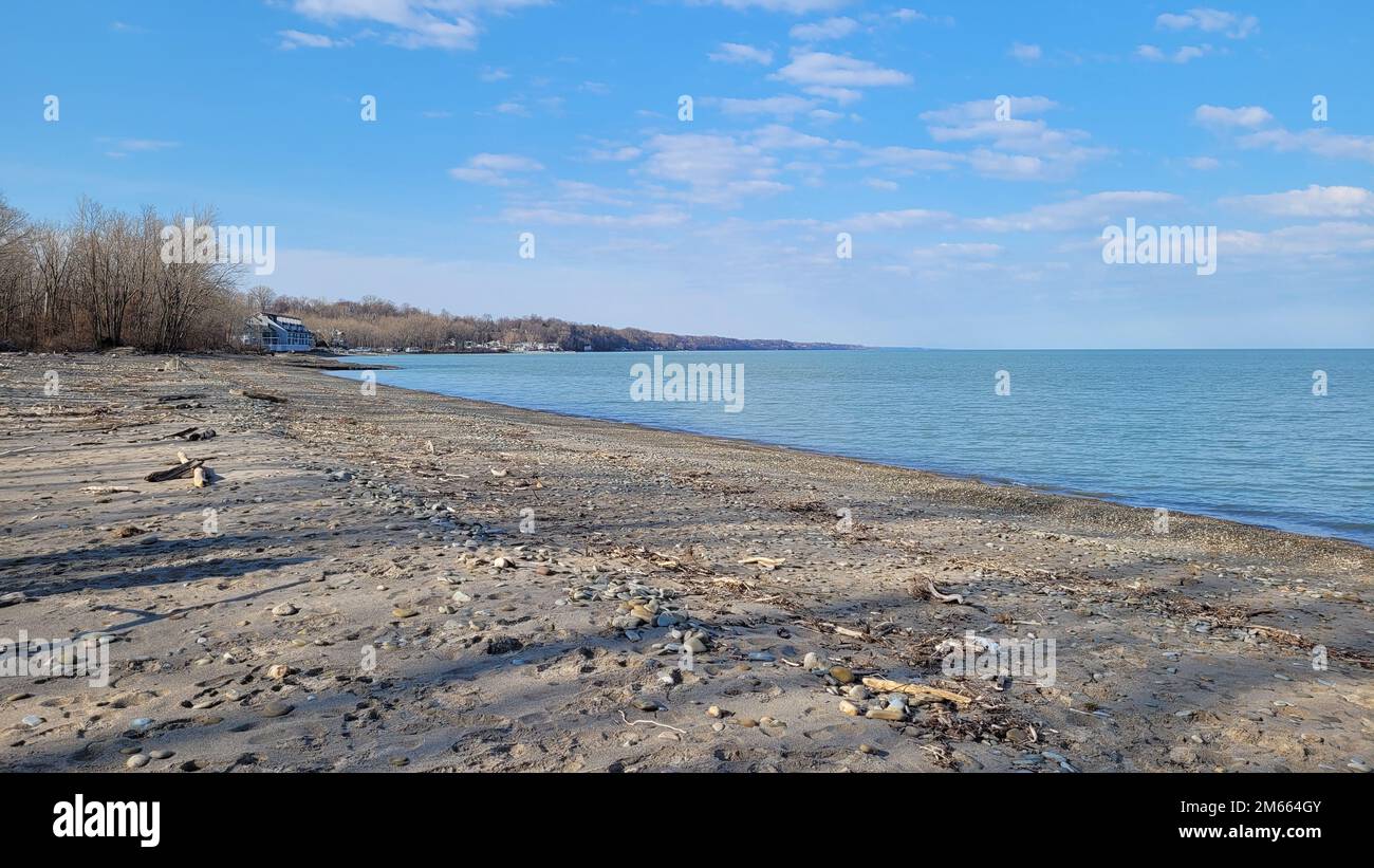 Sand lines the beach at Presque Isle State Park, part of a peninsula on ...