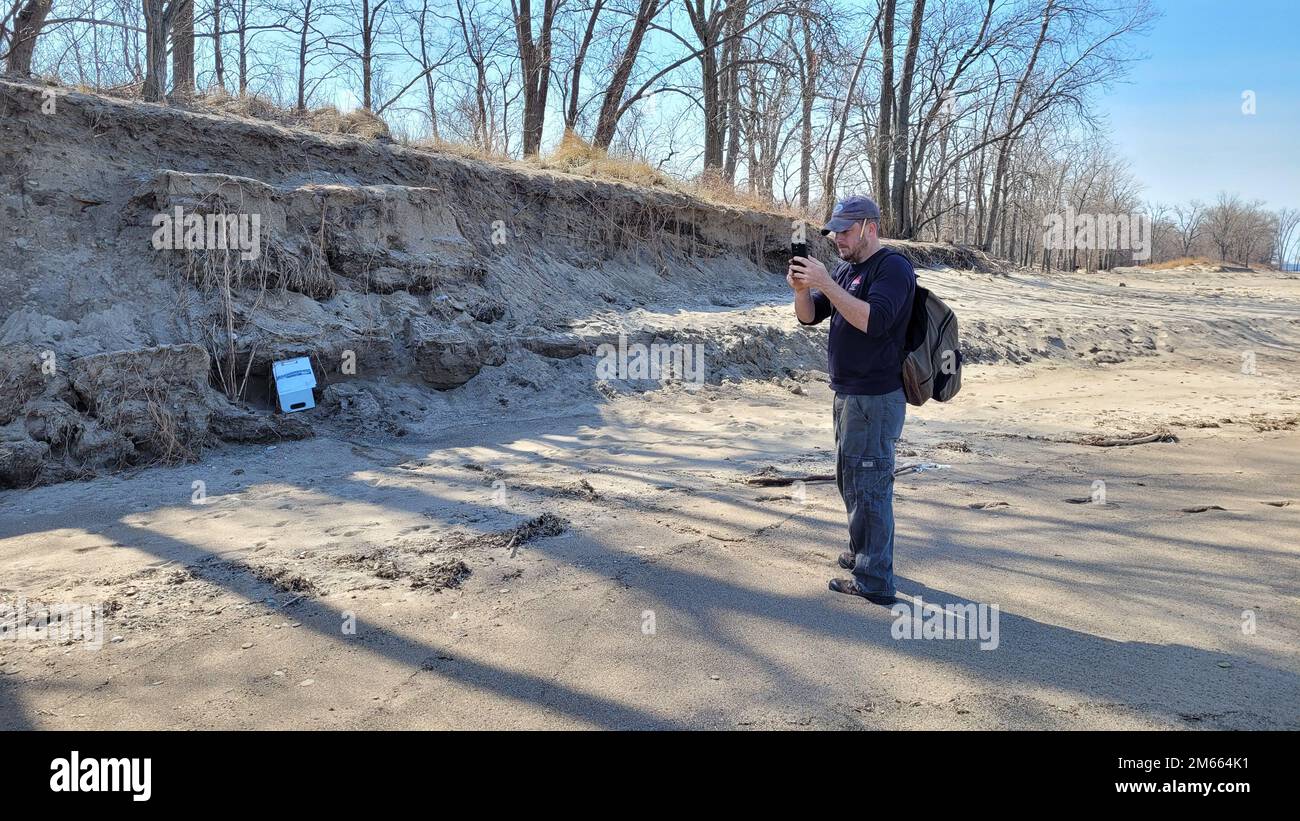 U.S. Army Corps of Engineers Coastal Geologist Weston Cross takes field ...