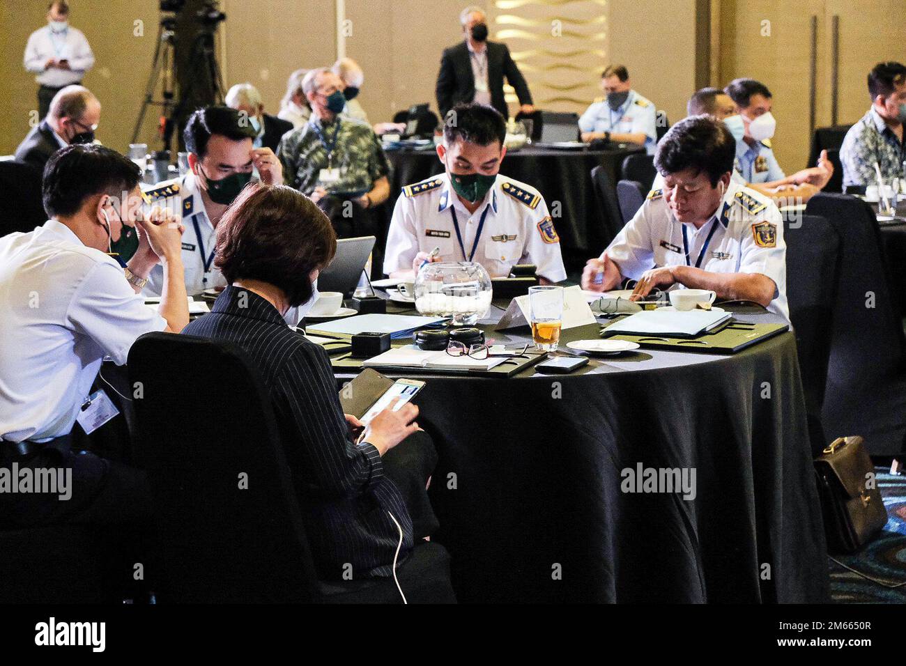 Vietnam Coast Guard leaders listen to speaker presentations during the ...