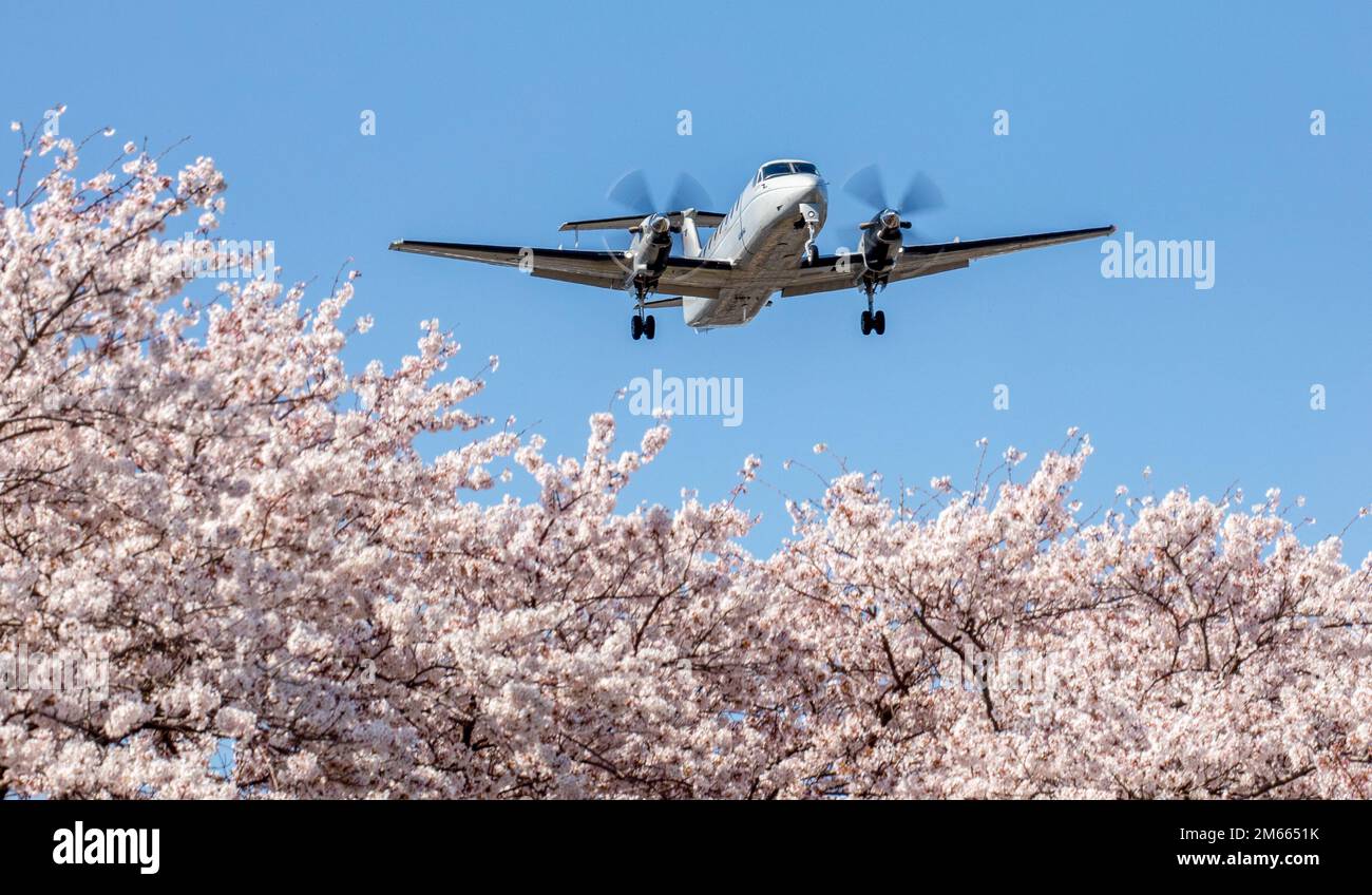 An Air Force C-12 Huron assigned to the 459th Airlift Squadron flies ...
