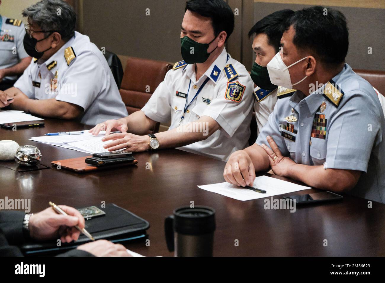(Left to right) First Adm. Maritime Ahmad Faridi Bin Ferdaus, director of Maritime Criminal ...