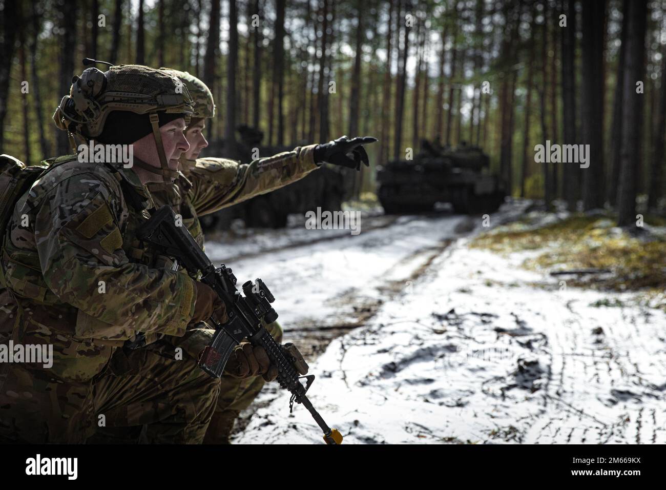 U.S. Army Sgt. 1st Class Justin Barros, left, a platoon sergeant with ...