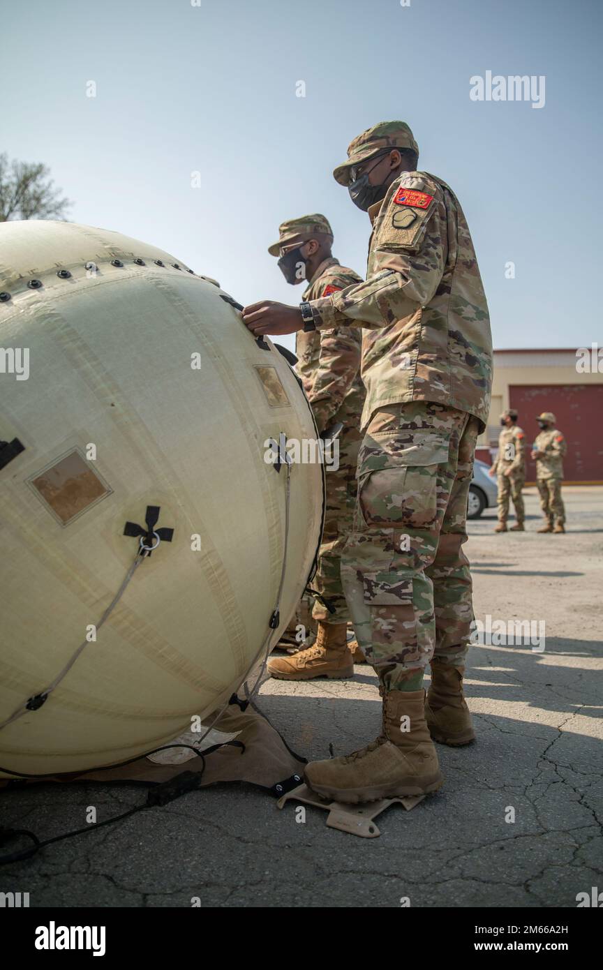 U.S. Army Soldiers assigned to 25th Transportation Battalion, set up an ...