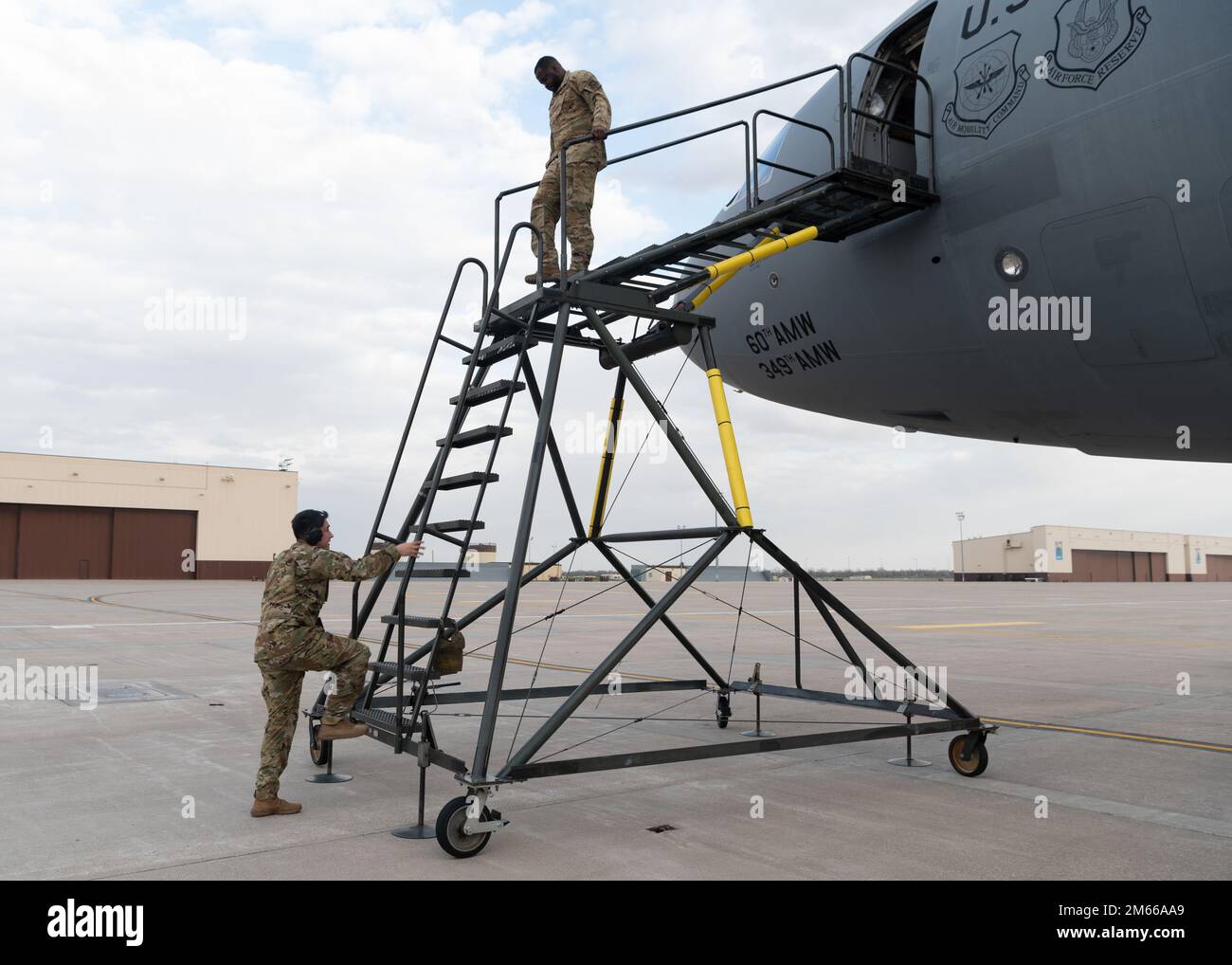 U.S. Air Force Staff Sgt. Enrique Reynoso and Staff Sgt. Ralph Fleurant ...