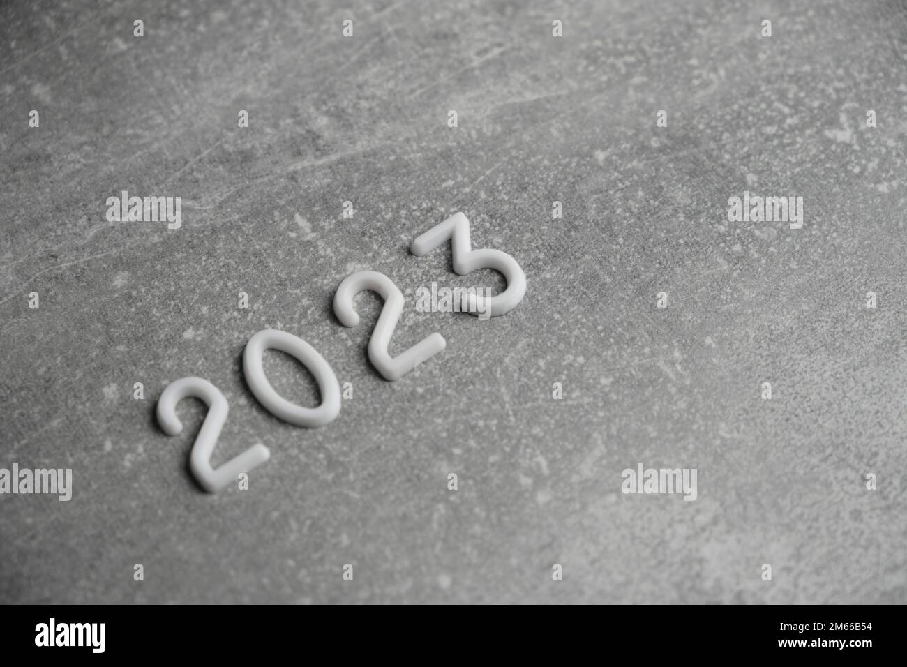 Year 2023 laid out in white numbers gray concrete background Stock ...