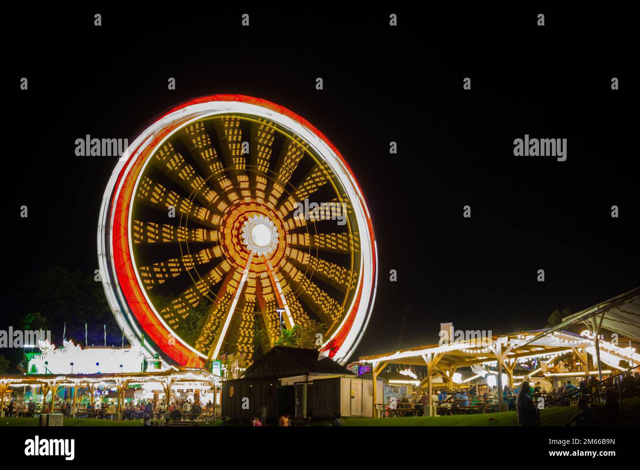 Summerfest carnival wheel at night, long exposure, in Munich, Germany ...