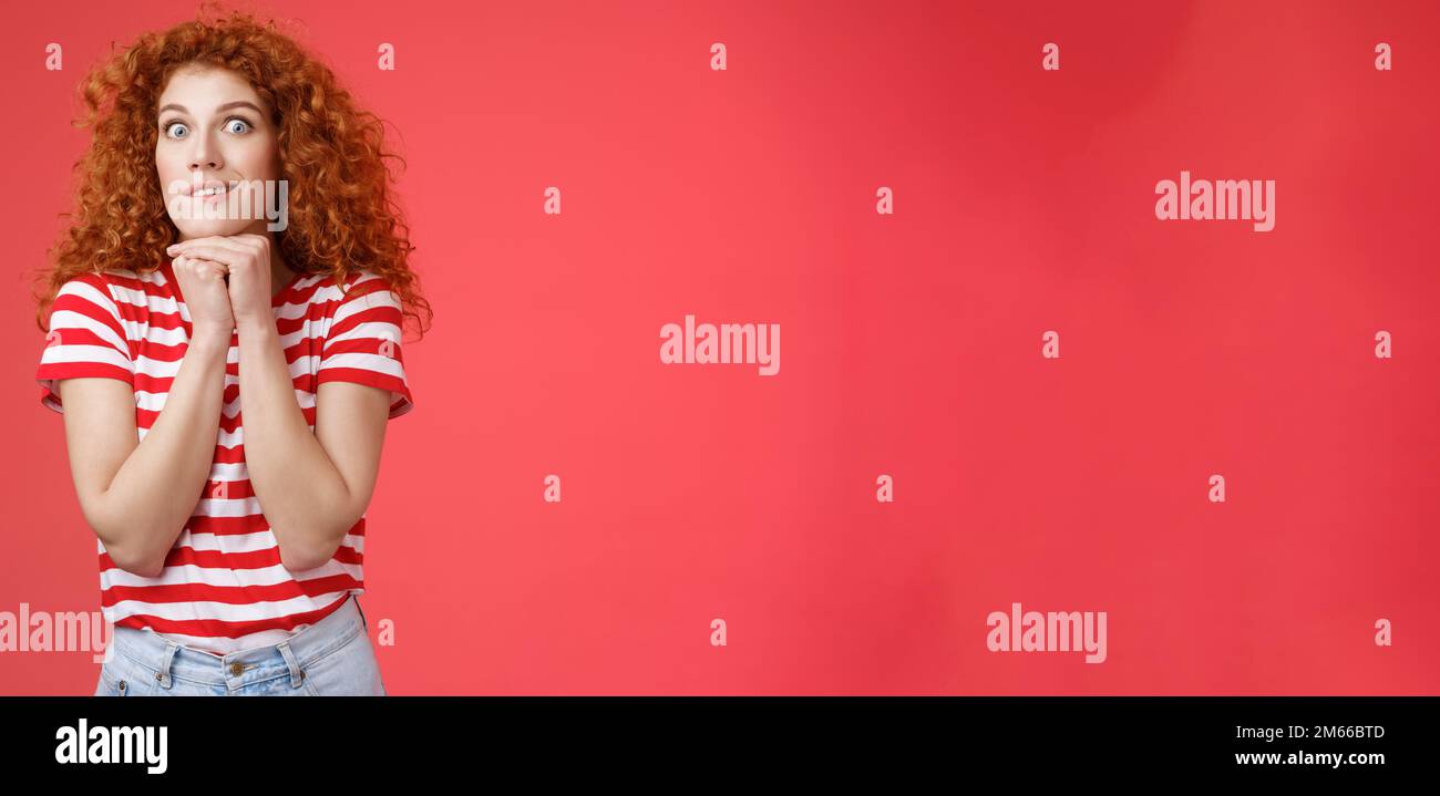 Excited thrilled young impulsive good-looking redhead female stare ...