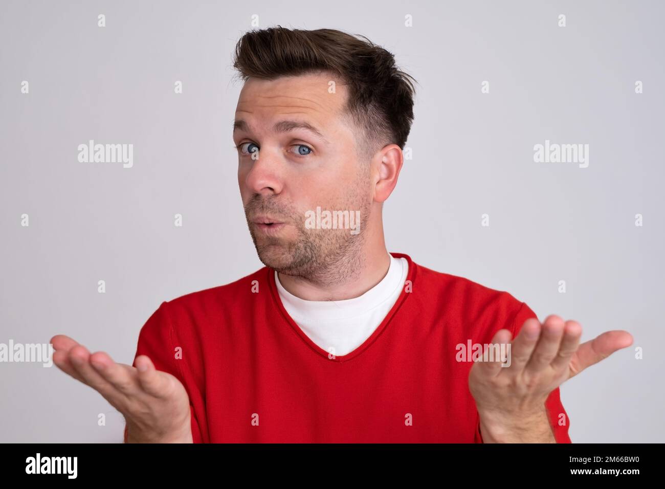 man clueless and confused expression with arms and hands raised Stock ...