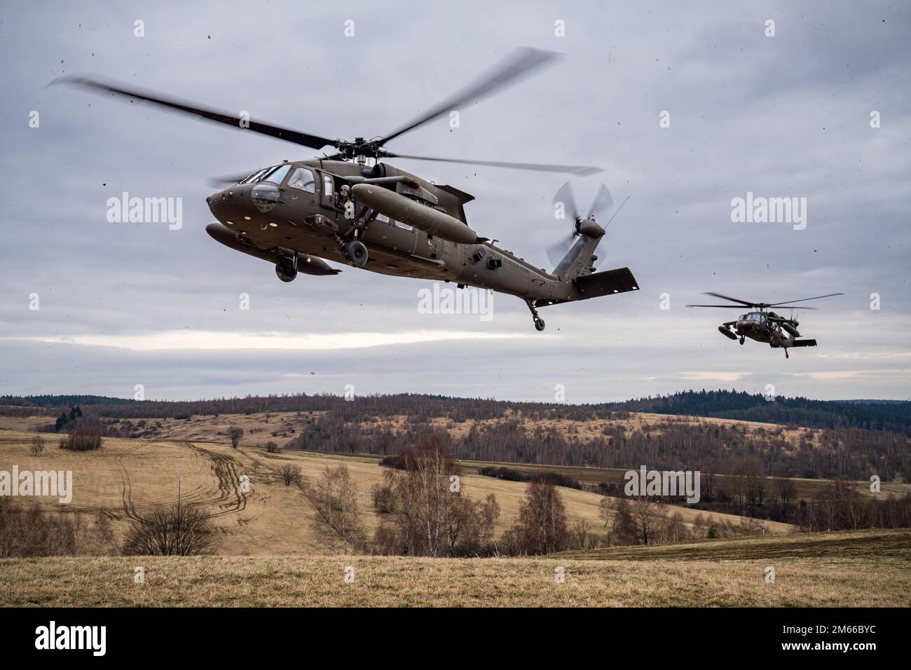Two U.S. Army UH-60 Blackhawk helicopters from the 1-214th General ...