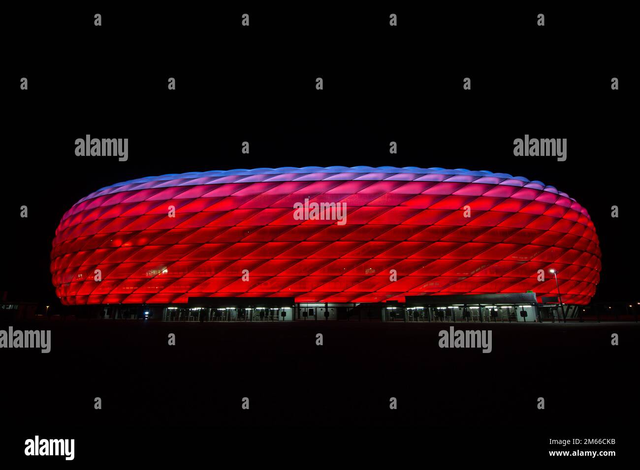 Football stadium at night and red light in long exposure in Munich ...