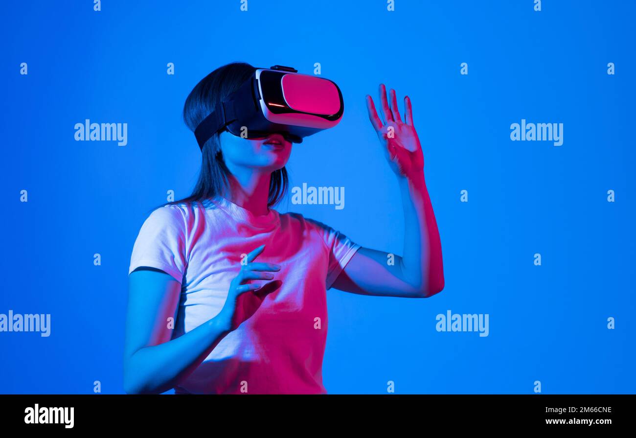 Brunette woman architect or engineer wearing VR headset for working ...