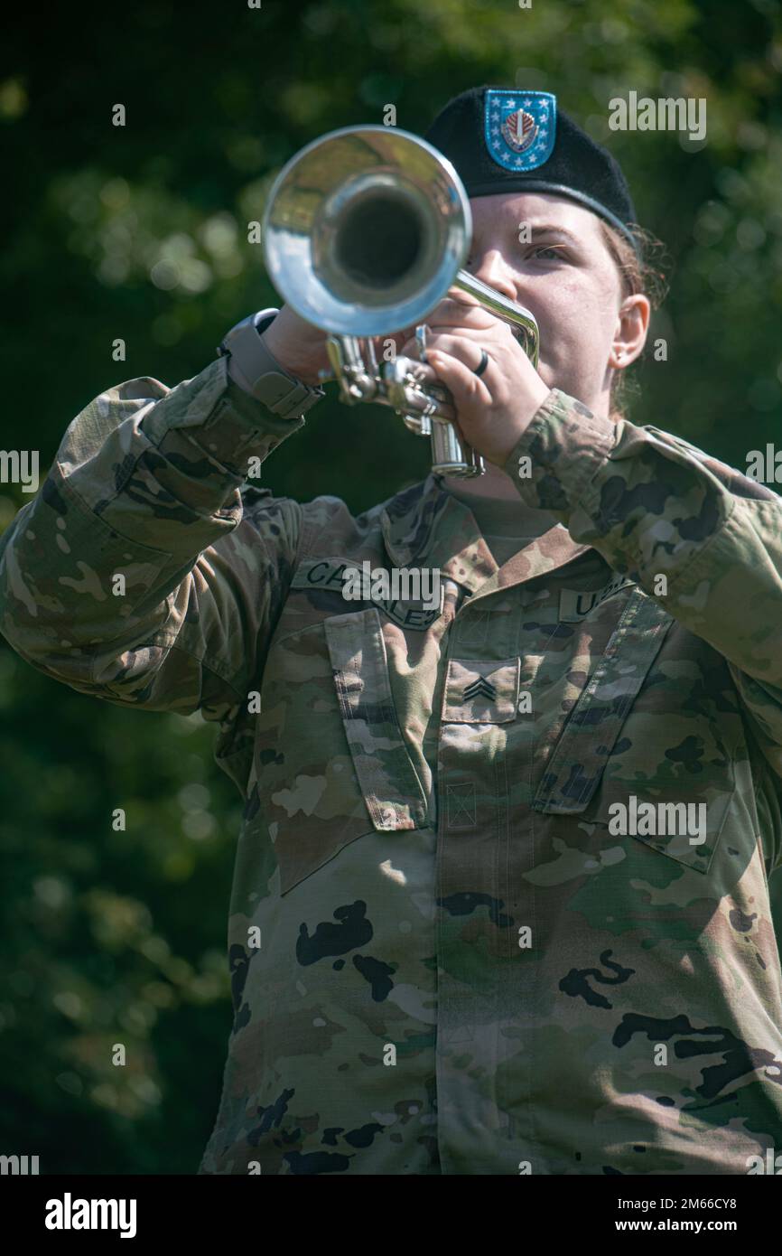 A U.S. Army Soldier plays taps during a ceremony at Le Balleuli ...