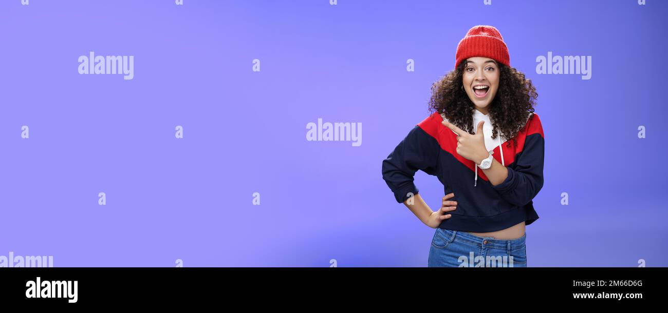 Portrait of enthusiastic and sociable european woman in warm hat and ...
