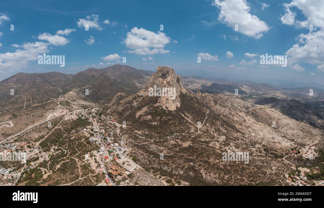 Panoramic view of Peña de Bernal, at the foot of the mountain the ...