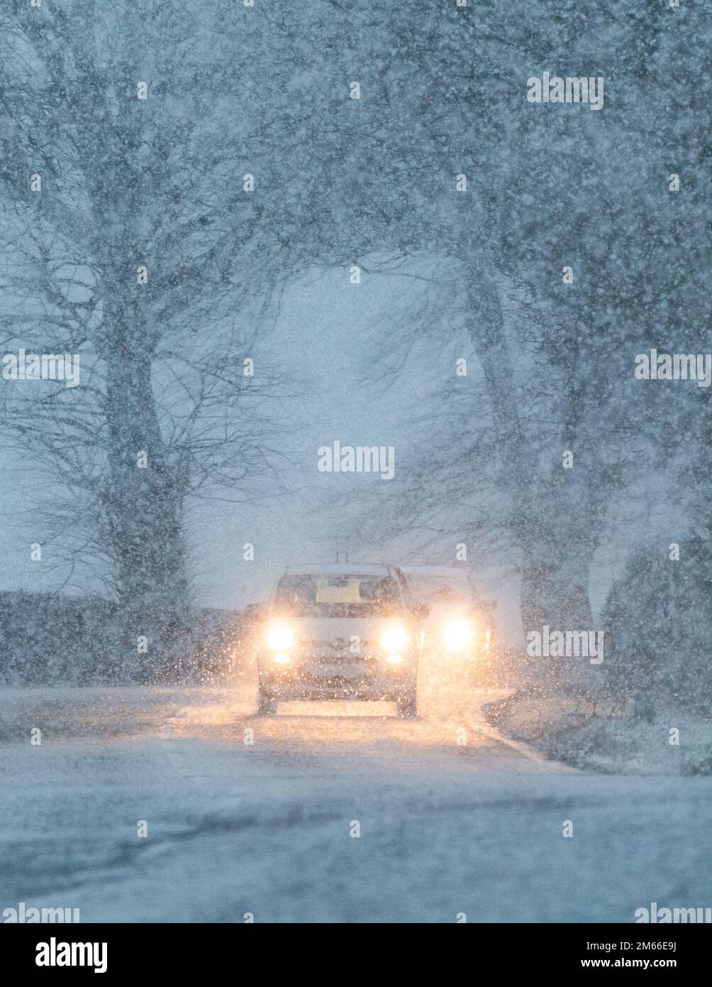 Cars driving in snow - Scotland, UK Stock Photo - Alamy