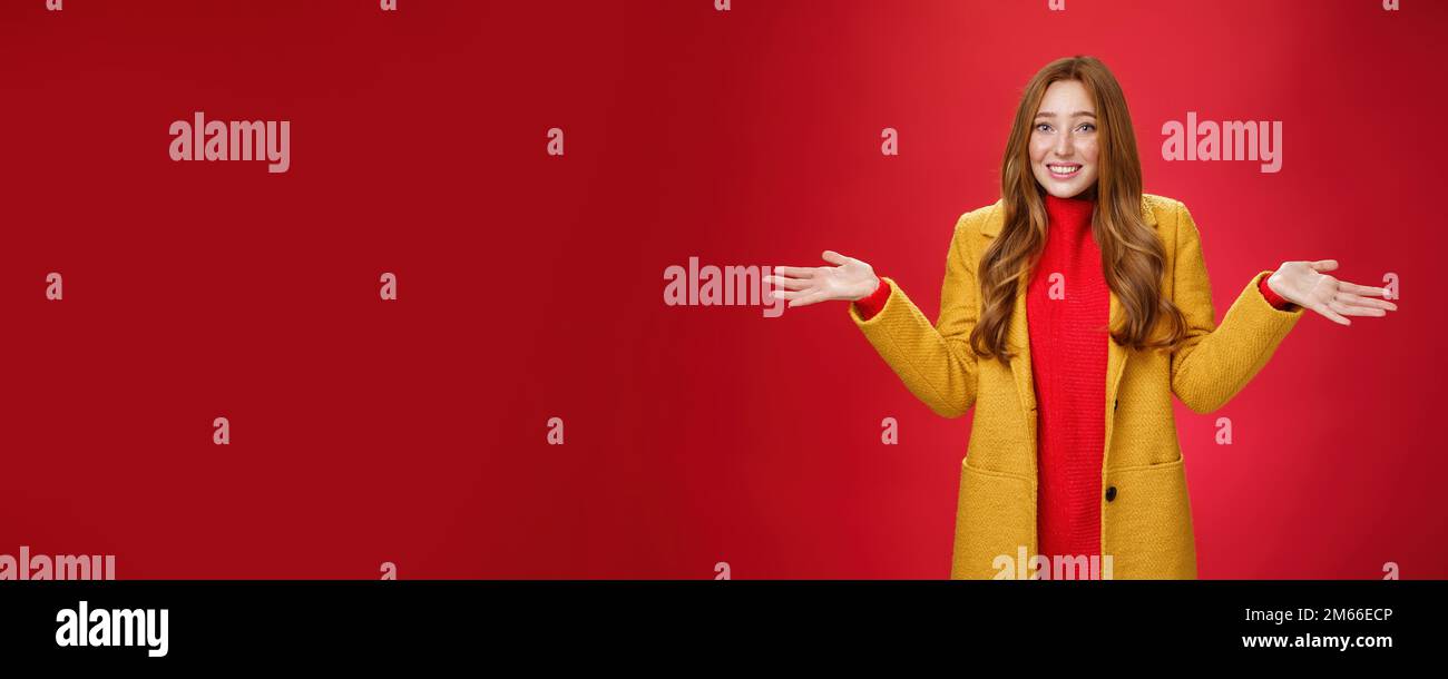 Redhead girl apologizes for being late smiling silly and guilty with ...