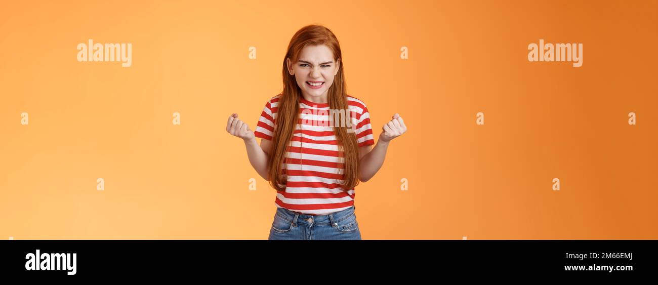 Annoyed pissed redhead female lose competition, clench fists angry ...