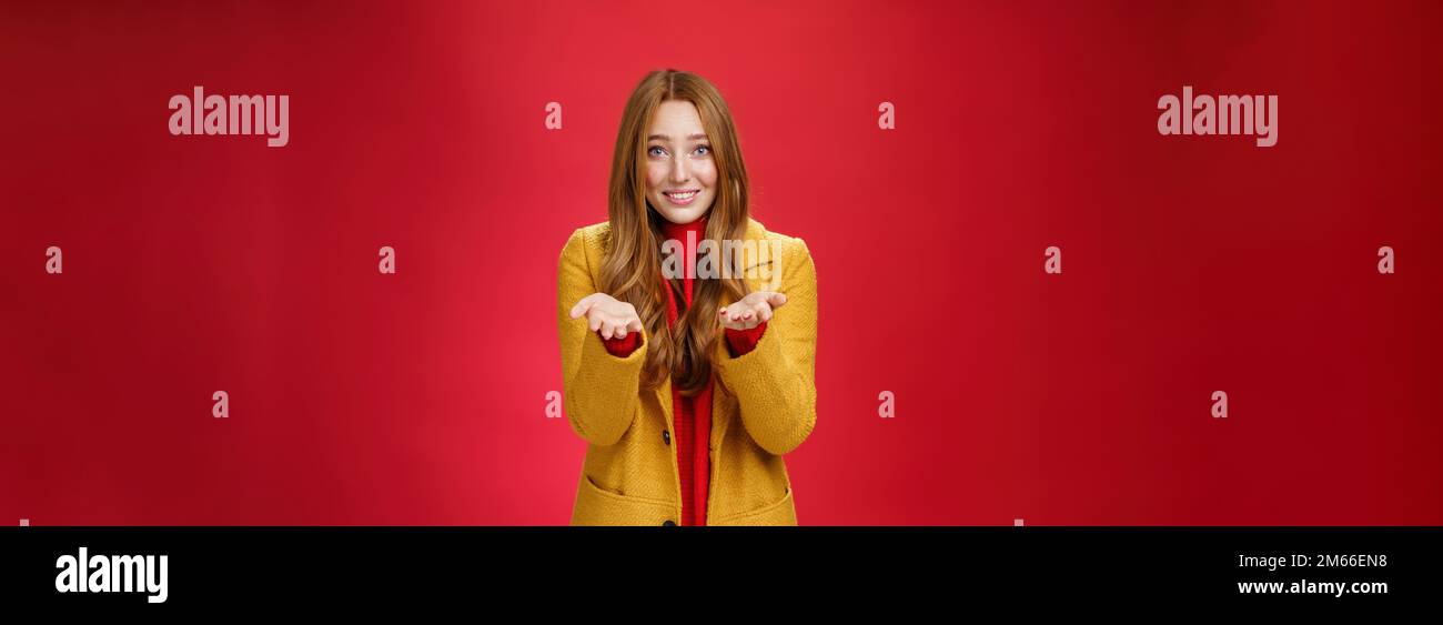 Girl with tender and caring expression smiling extanding hands forward ...