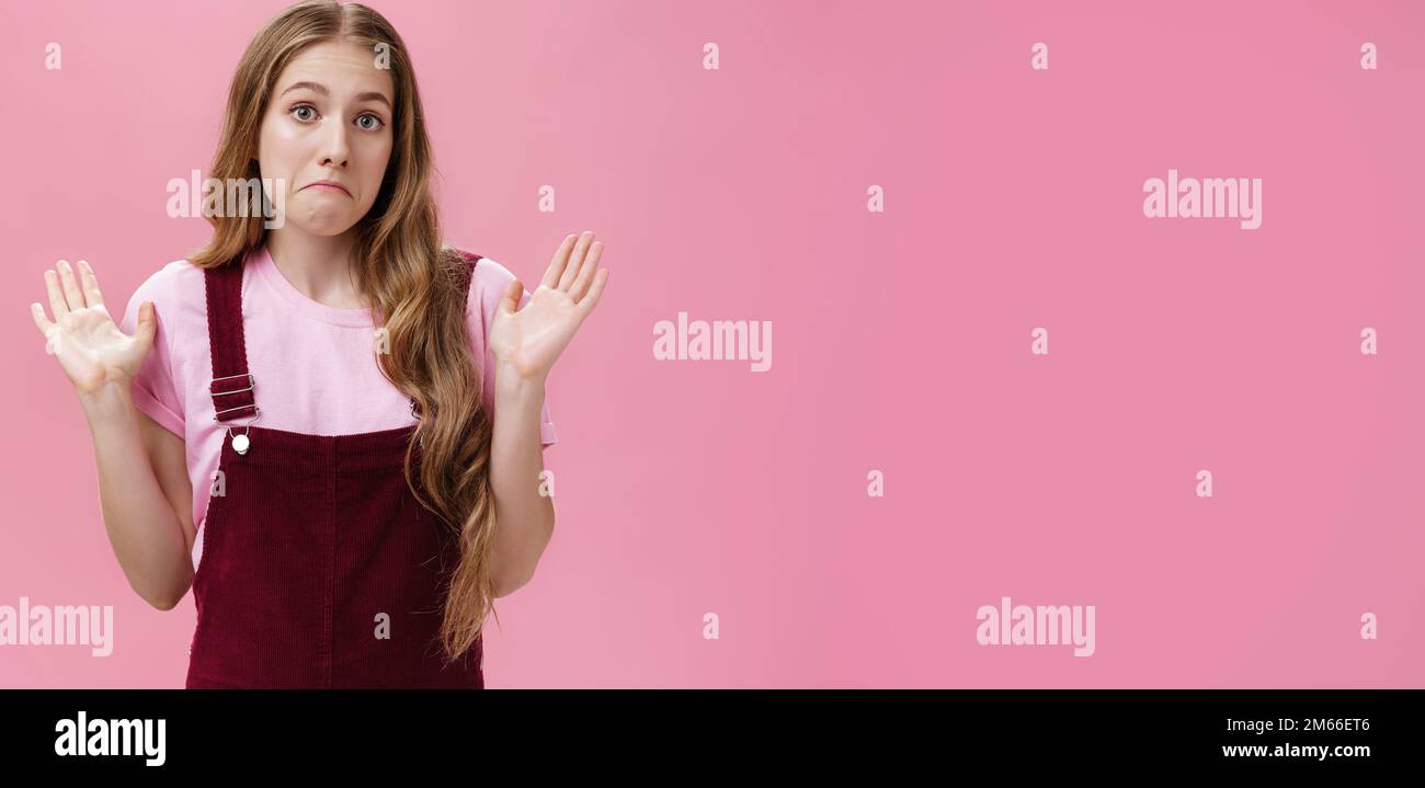 I am not involved. Portrait of unaware and clueless innocent cute woman ...