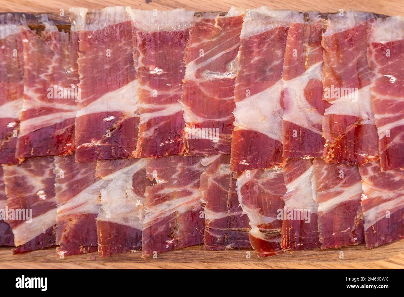 A top view of meat slices on a wooden tray Stock Photo - Alamy