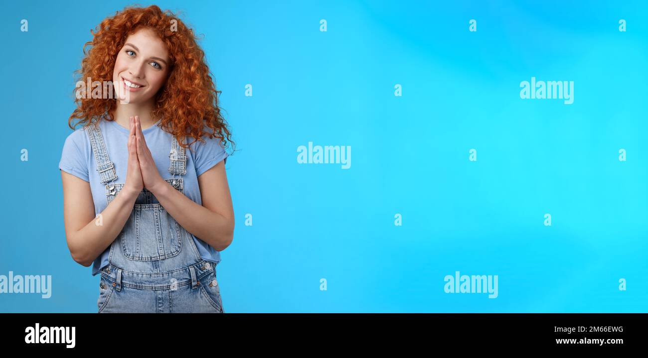 Girl acting like nun redhead cute curly female press palms together ...