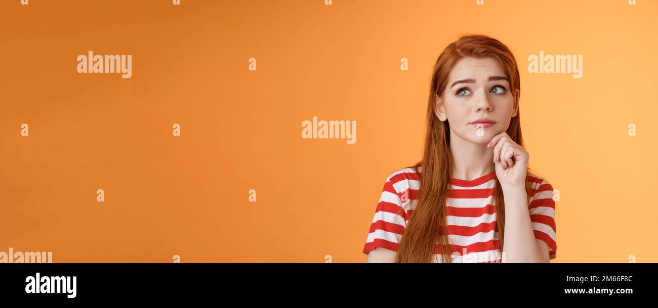 Close-up uneasy cute redhead female student facing tough troublesome ...