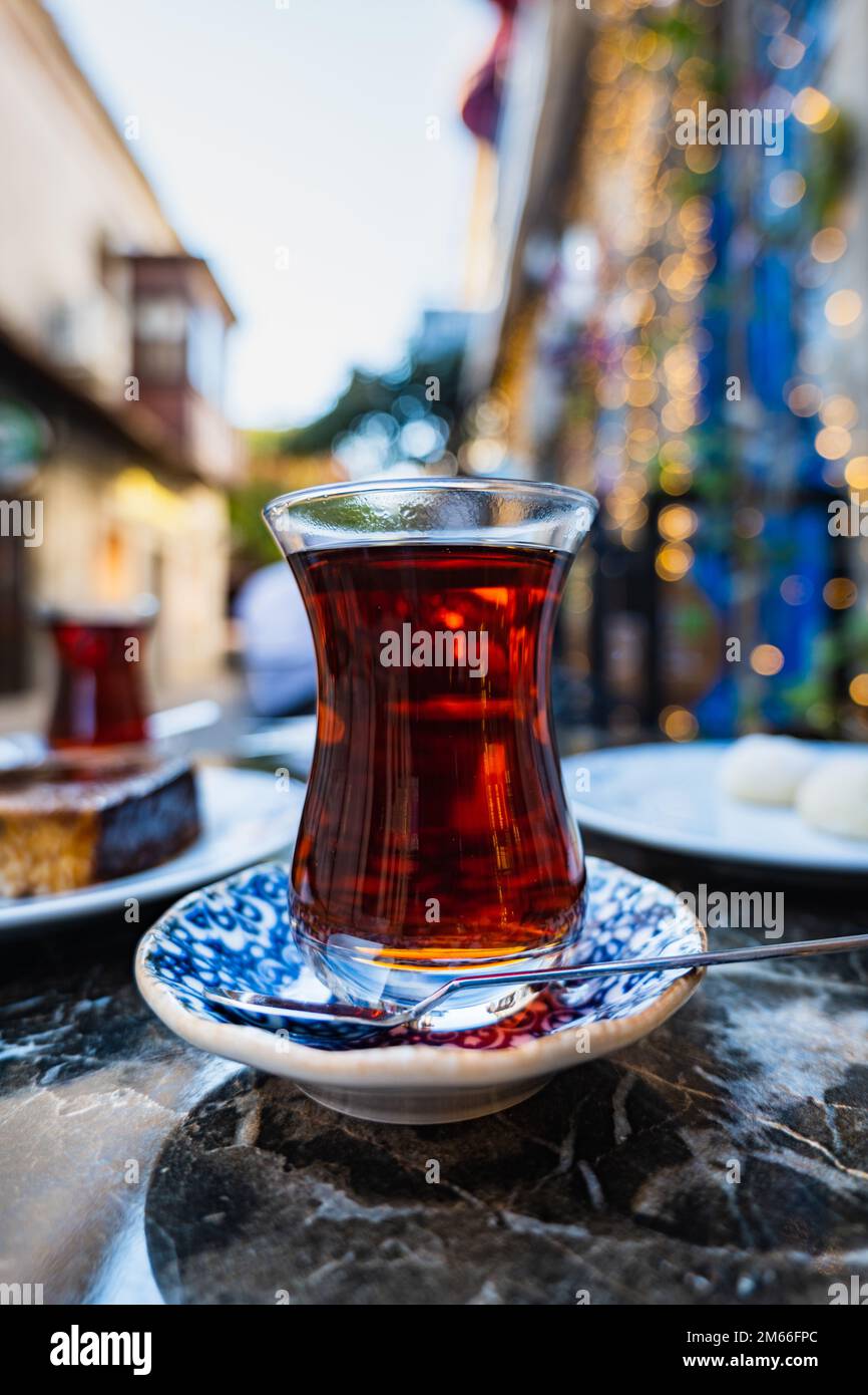 Turkish Tea in traditional tea glass and saucer in Turkey, street ...