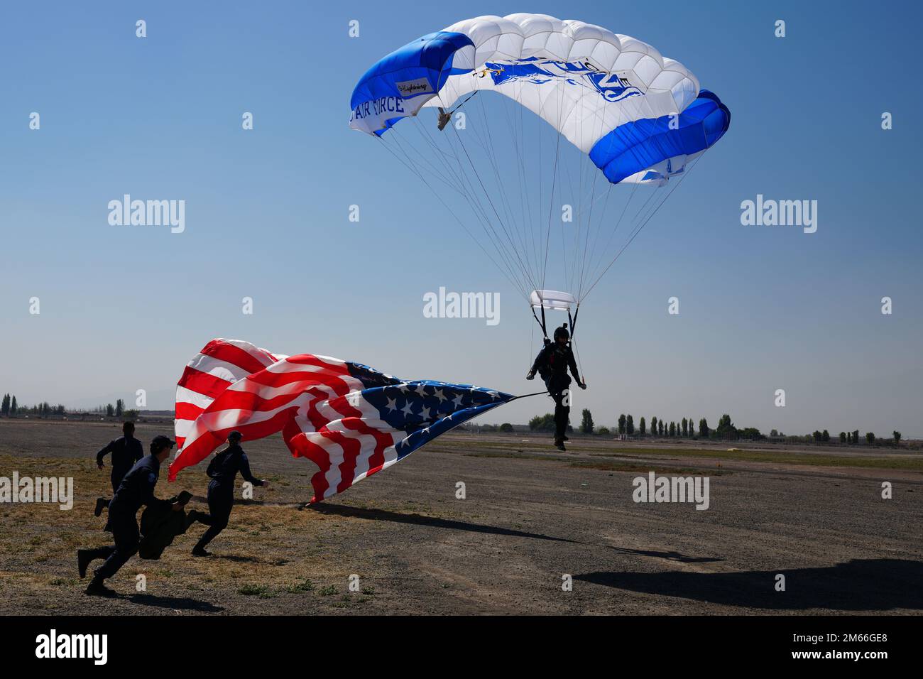 Three members of the U.S. Air Force Academy Wings of Blue Parachute ...